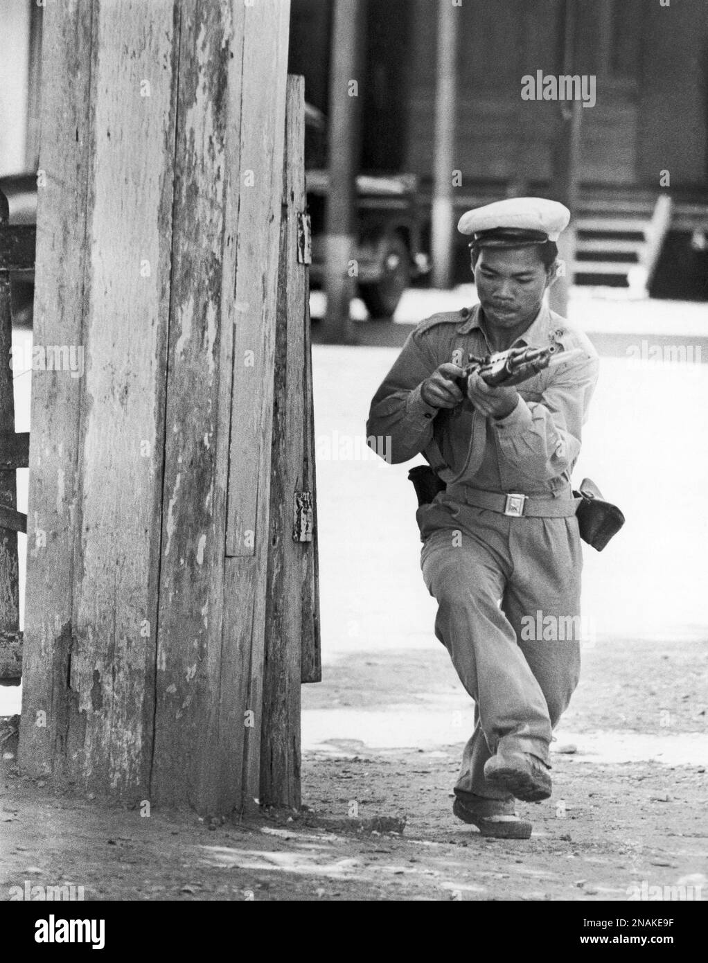 A soldier guarding the quarters of the communist Pathet Lao in ...