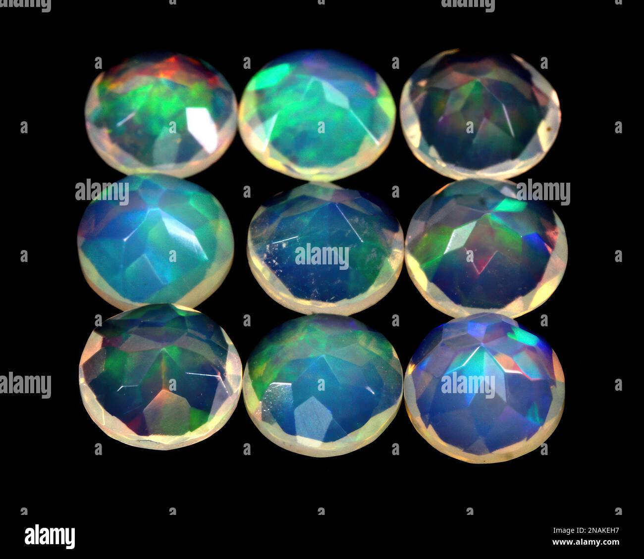 Natural gemstone noble opal on a black background Stock Photo - Alamy