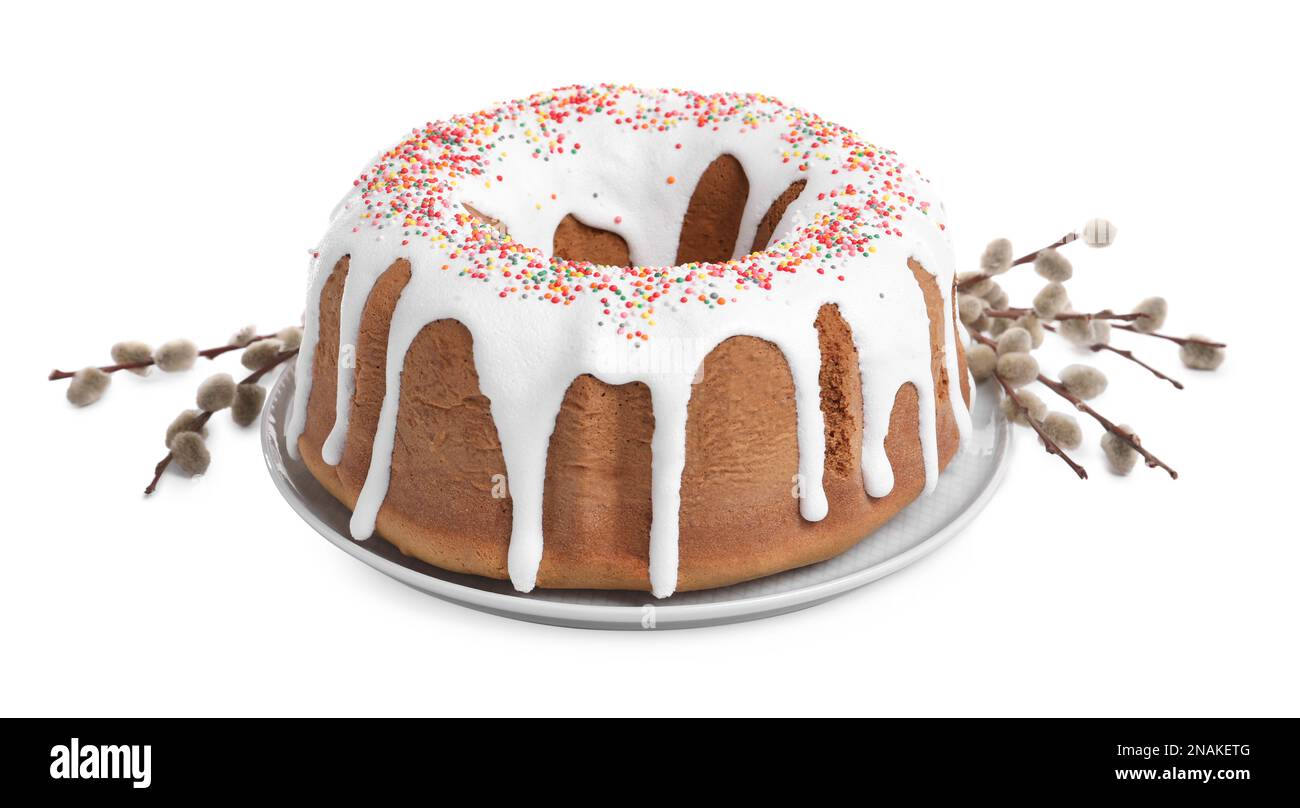 Glazed Easter cake with sprinkles and willow branches on white ...