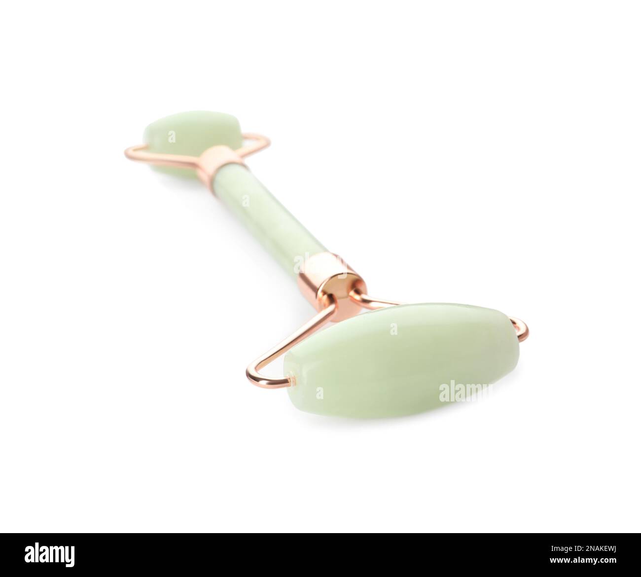 Natural jade face roller on white background Stock Photo - Alamy