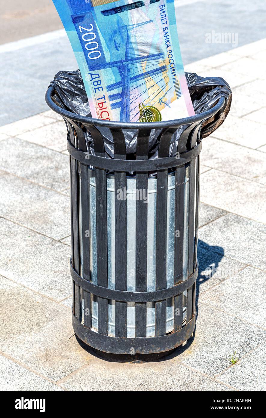 Russian rouble banknote in the garbage bin. Trash can with russian ...