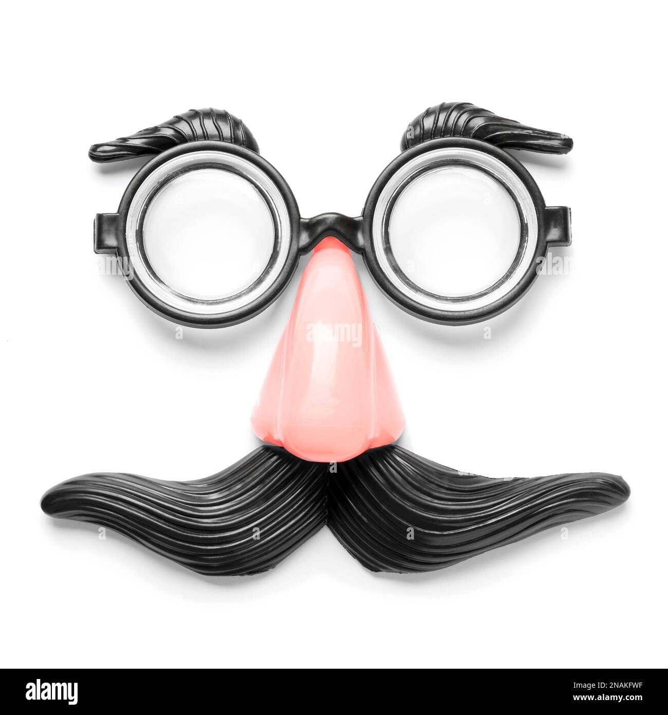 Funny face made with clown's accessories on white background, top view ...
