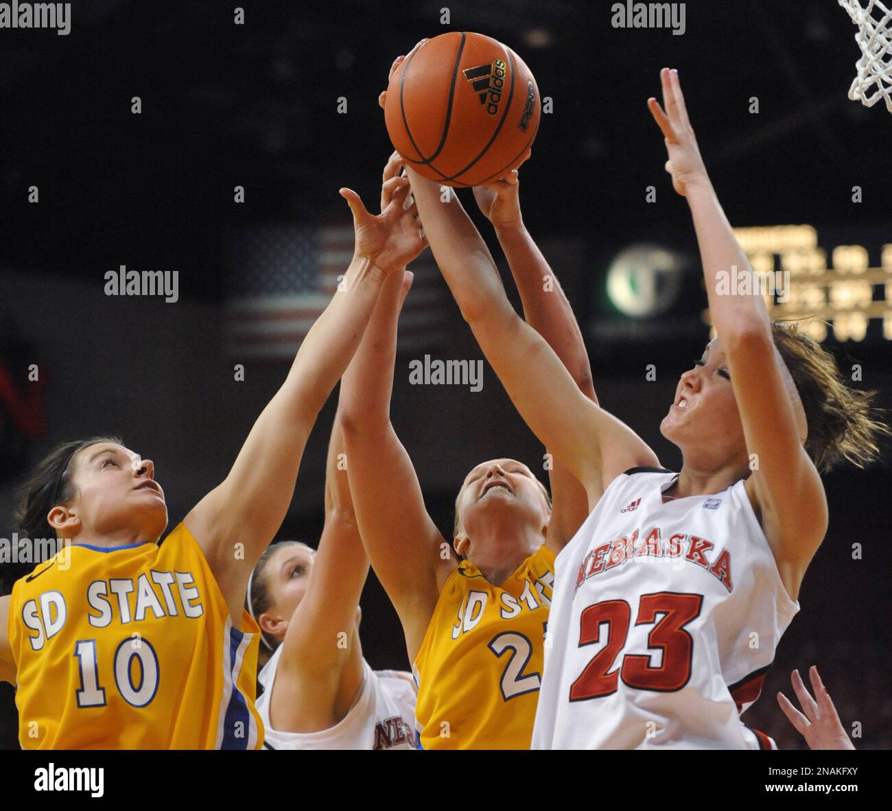 Nebraska's Emily Cady (23) goes for a rebound in front of South Dakota ...