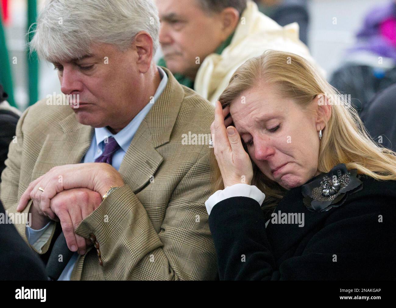 John Sweeney, left, and his wife Stacey attend a ceremony at the ...