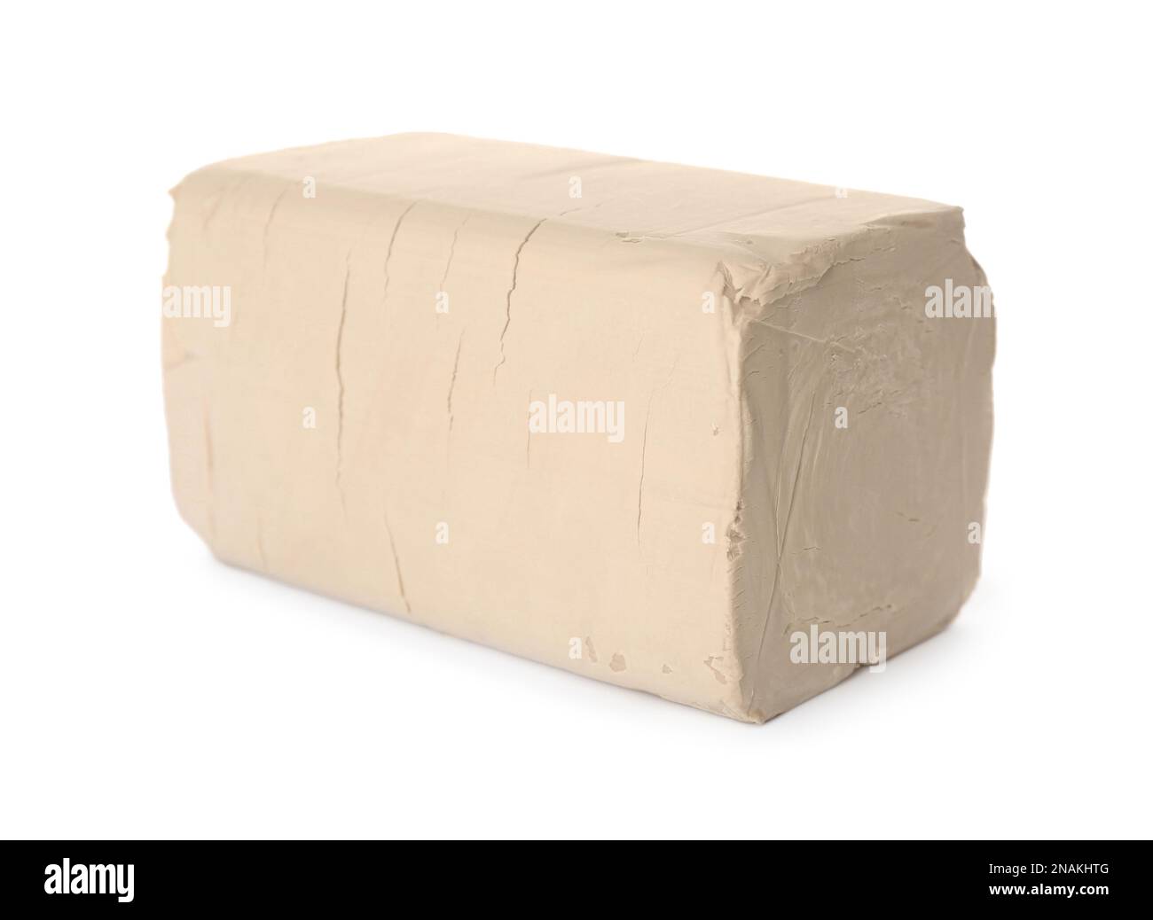 Block of compressed yeast on white background Stock Photo - Alamy