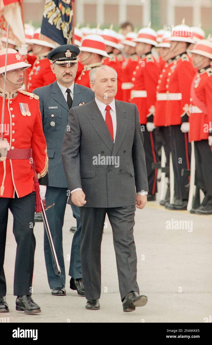 Soviet President Mikhail Gorbachev reviews an honor guard upon his ...