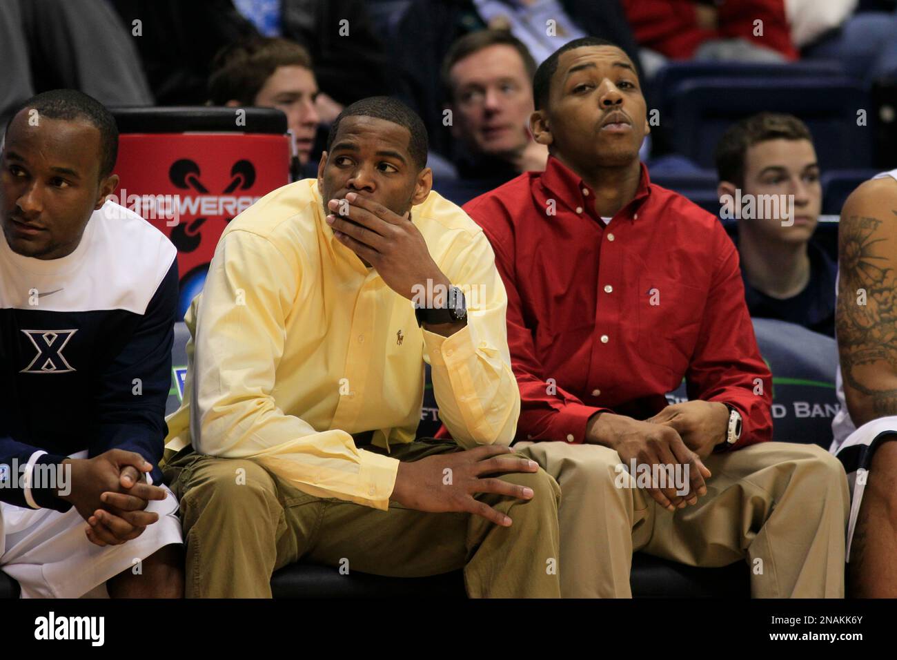 Xavier guard Tu Holloway, center left, and guard Mark Lyons, right ...
