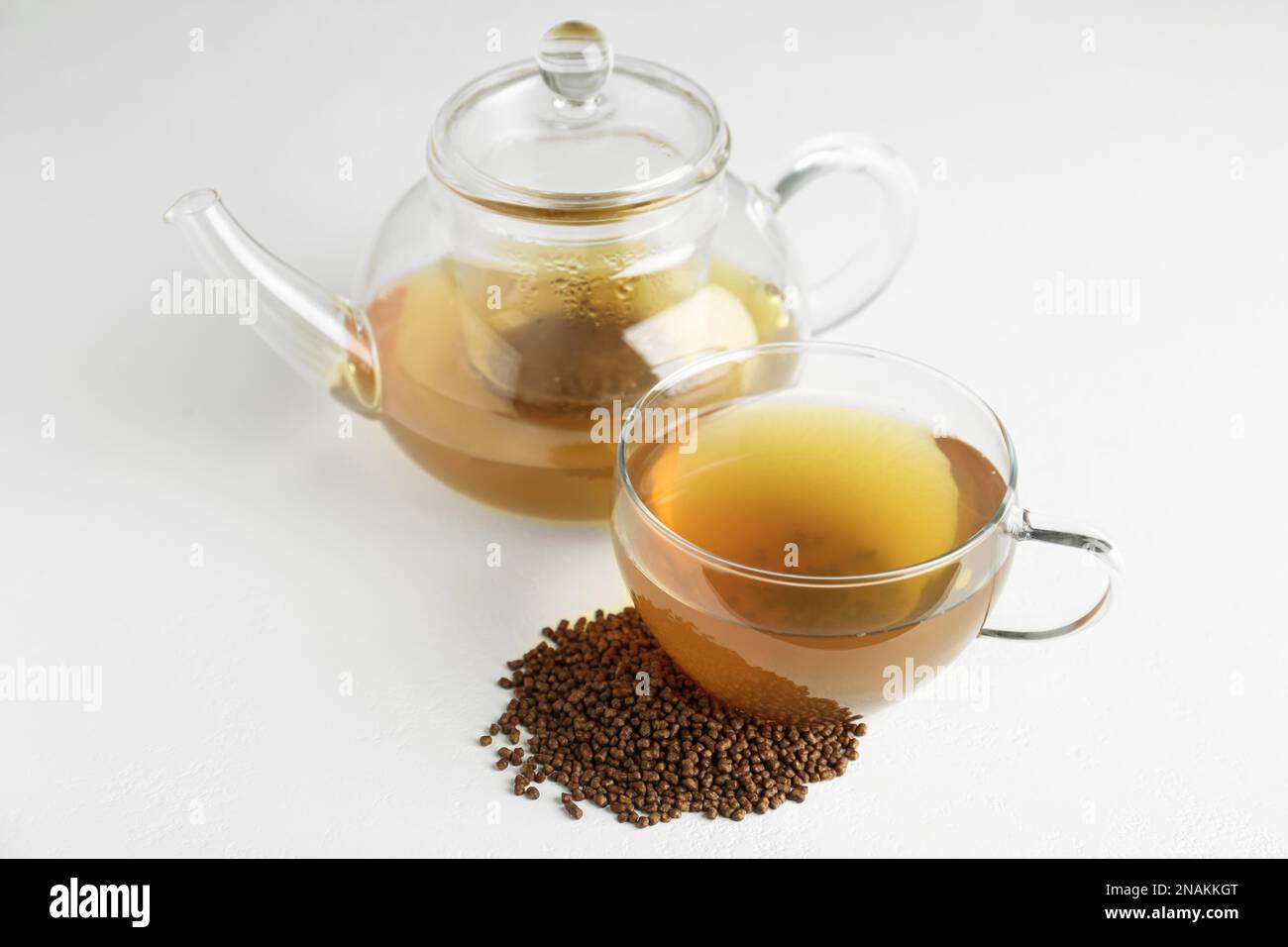 Delicious buckwheat tea and granules on white background Stock Photo ...