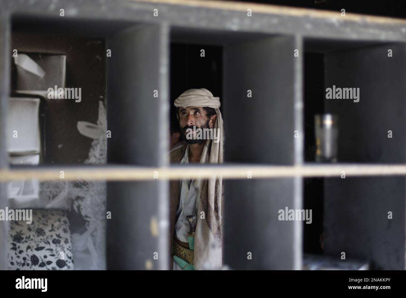 An armed Yemeni tribesman loyal to Sheik Sadeq al-Ahmar, the head of ...