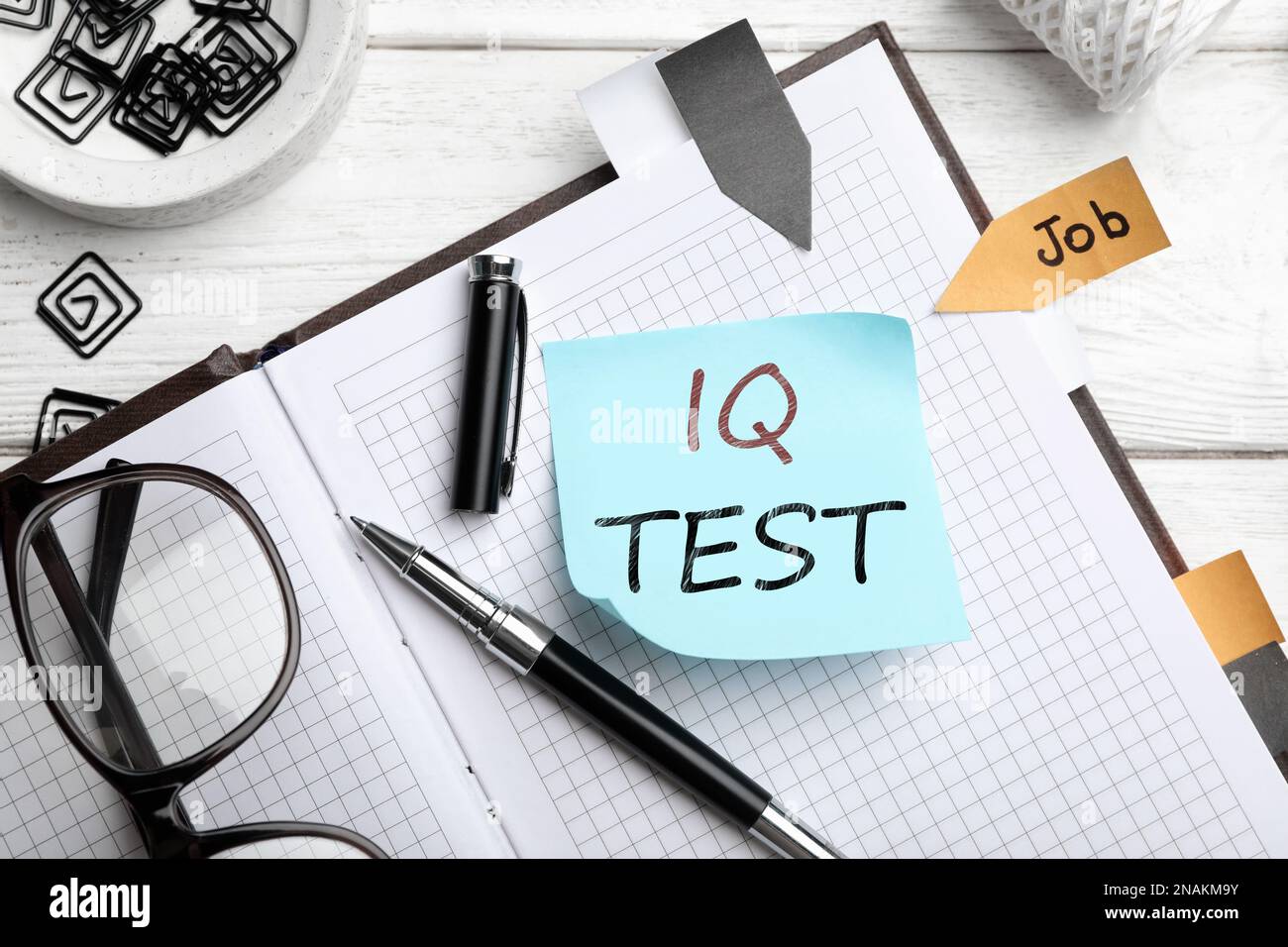 Sticky note with text IQ Test and stationery on table, flat lay Stock ...