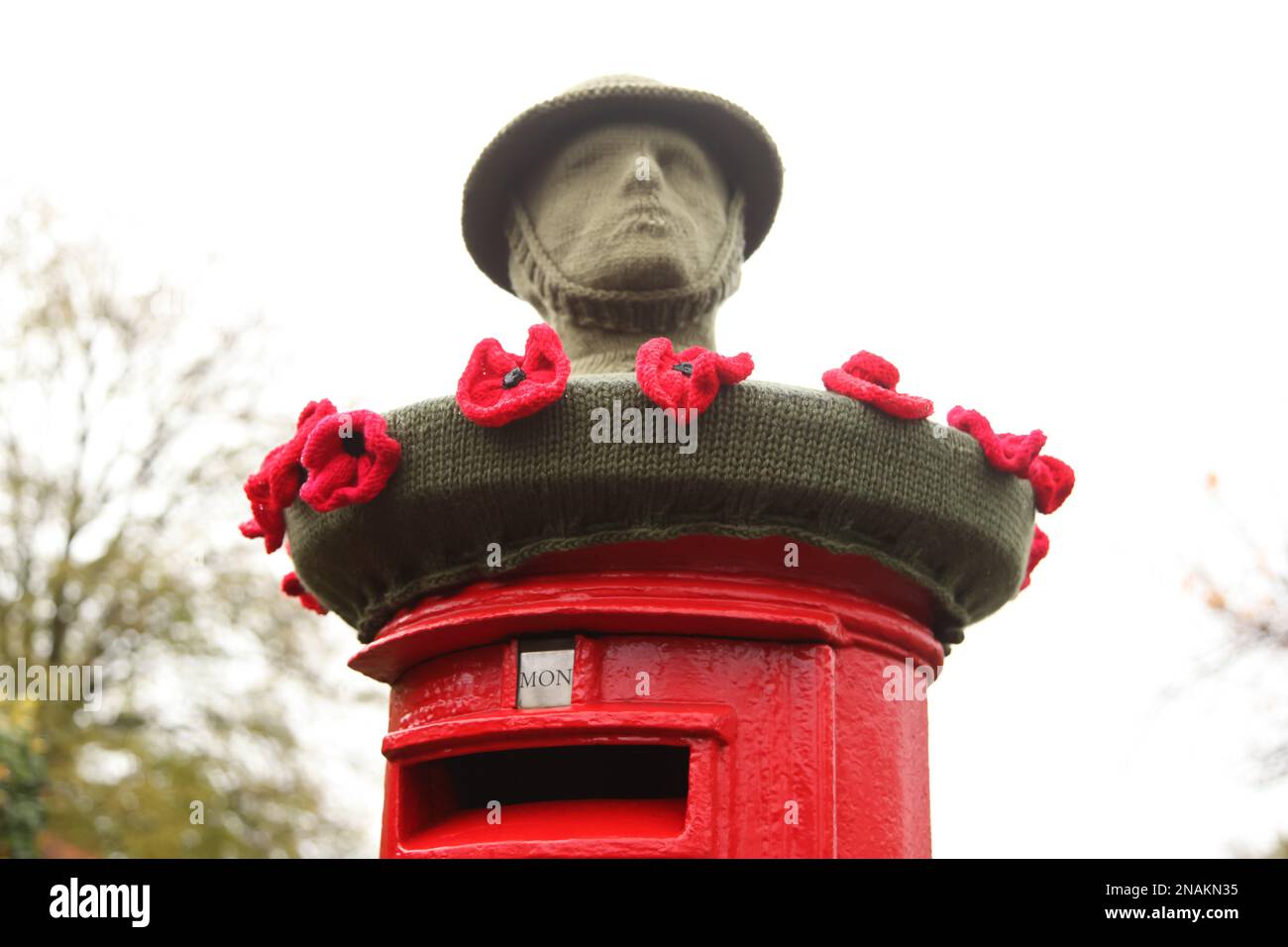British Red Post Box ERII with crochet ww2 soldier topper Stock Photo ...