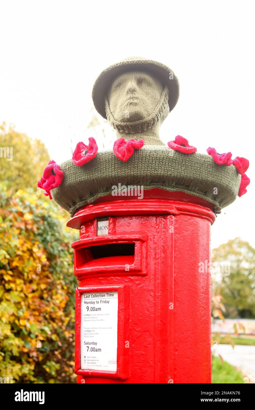British Red Post Box ERII with crochet ww2 soldier topper Stock Photo ...