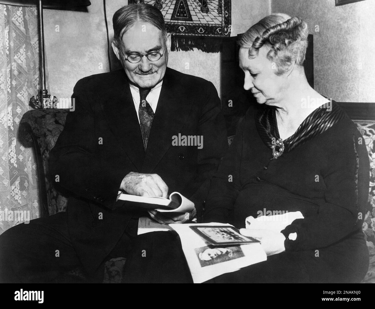 Dr. James Naismith and his wife Maude are shown in Lawrence, Kansas on Feb. 11, 1936, discussing ...