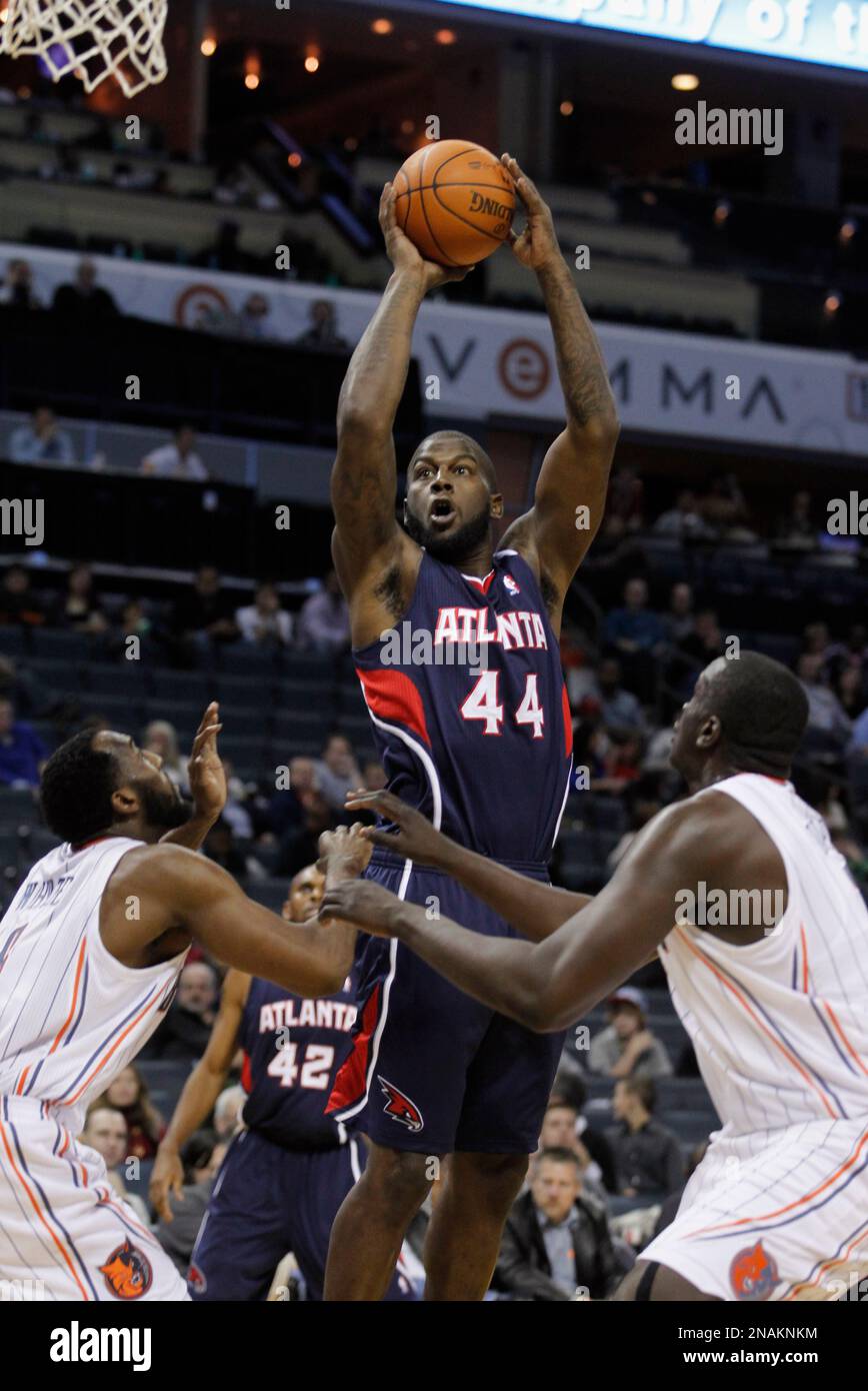 The Atlanta Hawks' Ivan Johnson (44) eyes the basket as he releases a ...