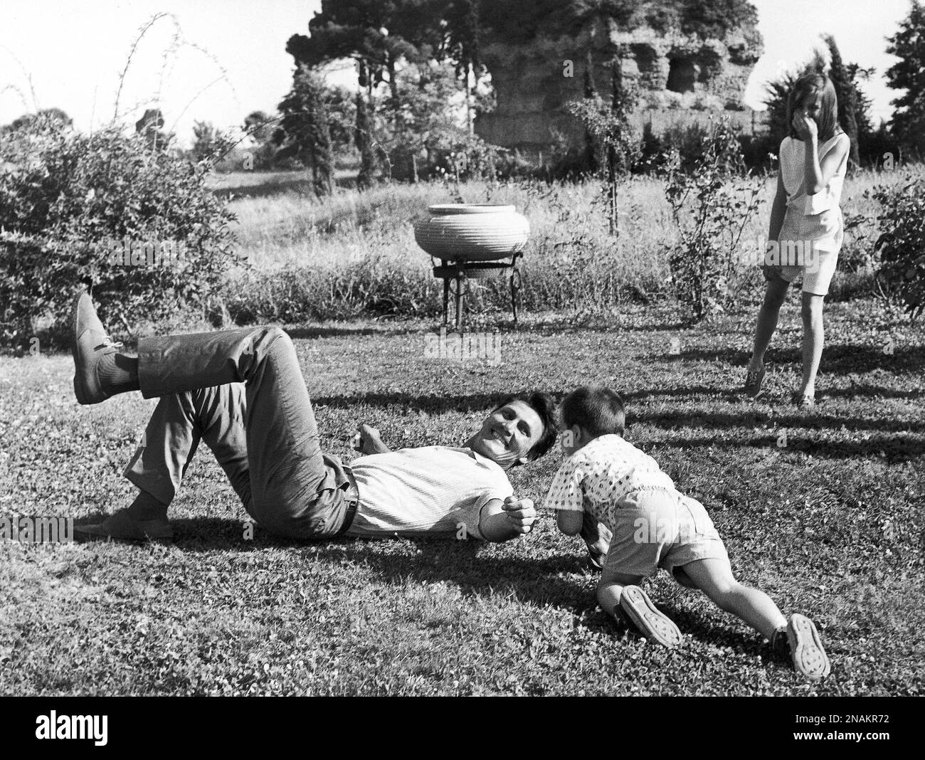 Hollywood actor Jack Palance shows he isn't always as tough and mean as he is in his western ...