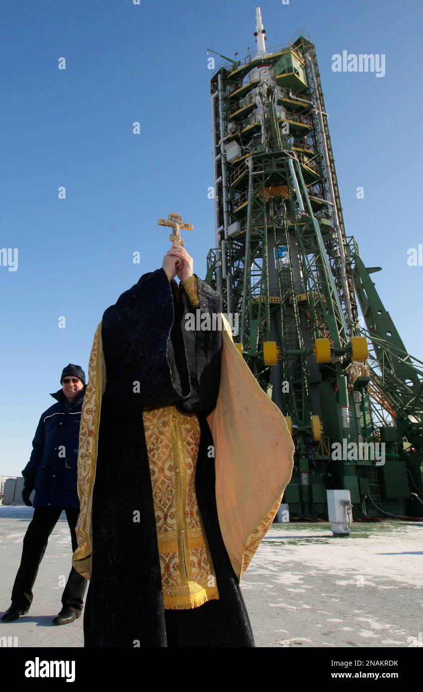 An Orthodox priest conducts a blessing service in front of the Russian ...