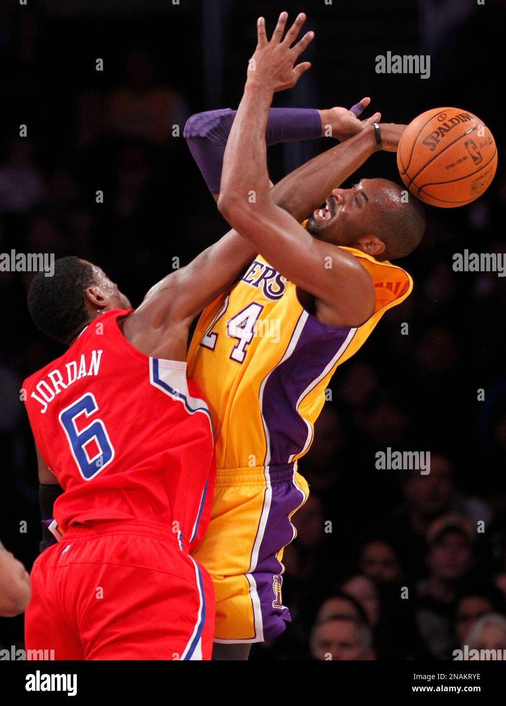 Los Angeles Clippers' DeAndre Jordan, left, fouls Los Angeles Lakers ...