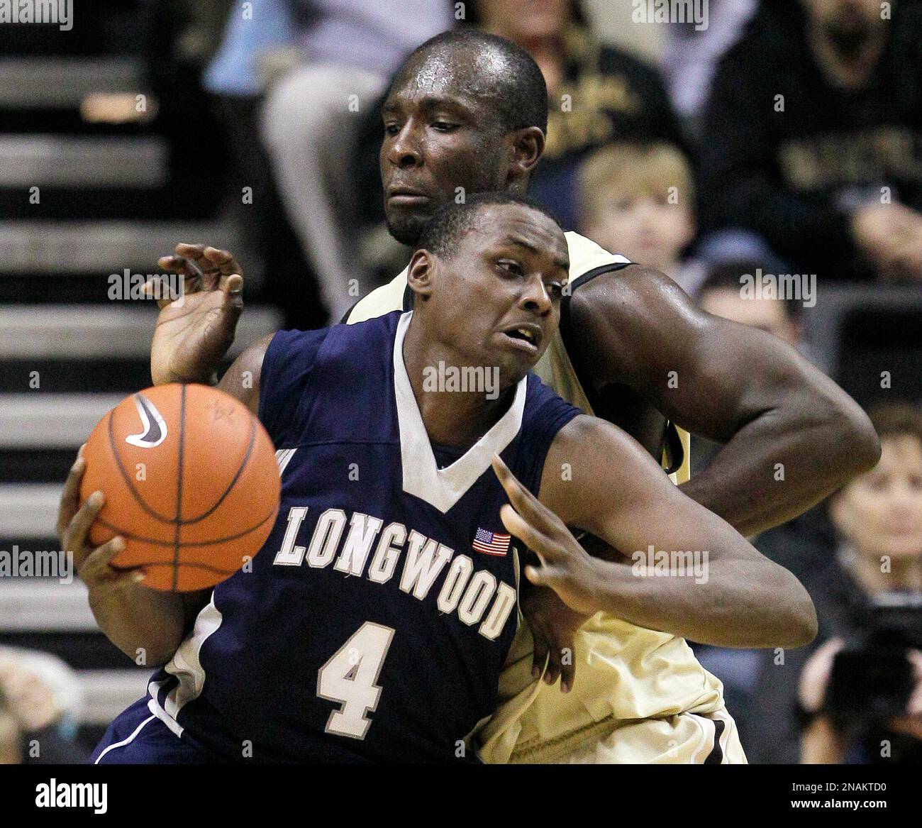 Longwood center Antwan Carter (4) drives against Vanderbilt forward ...