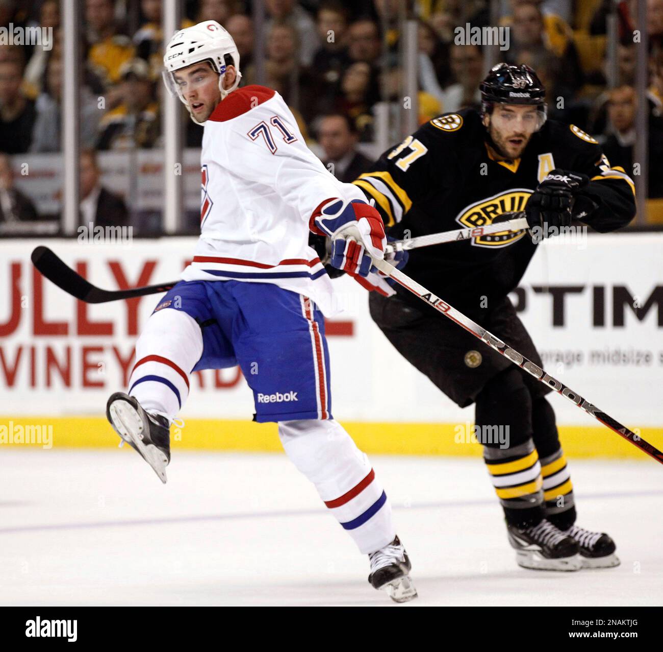 Montreal Canadiens center Louis Leblanc (71) is knocked off-balance by ...