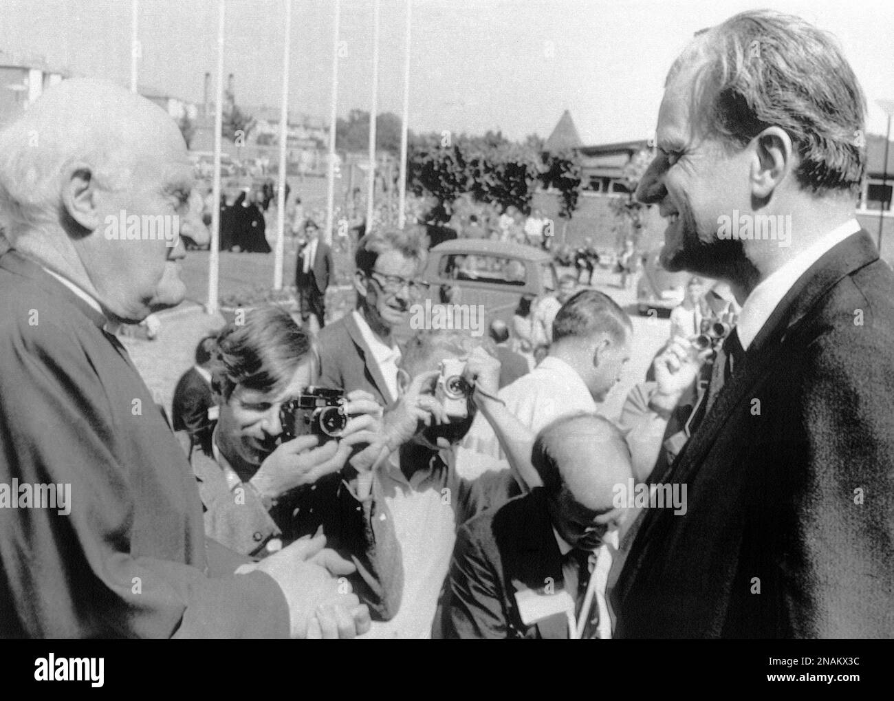 American evangelist Billy Graham, right, stops on his way to session of ...