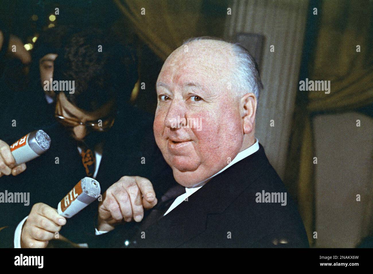 British film director Alfred Joseph Hitchcock smiles during an ...