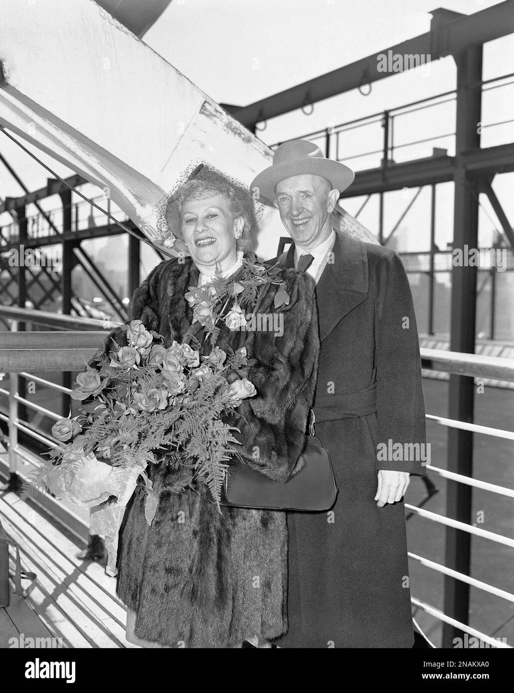 Movie comedian Stan Laurel and his wife, Ida, pose aboard the Cunard ...