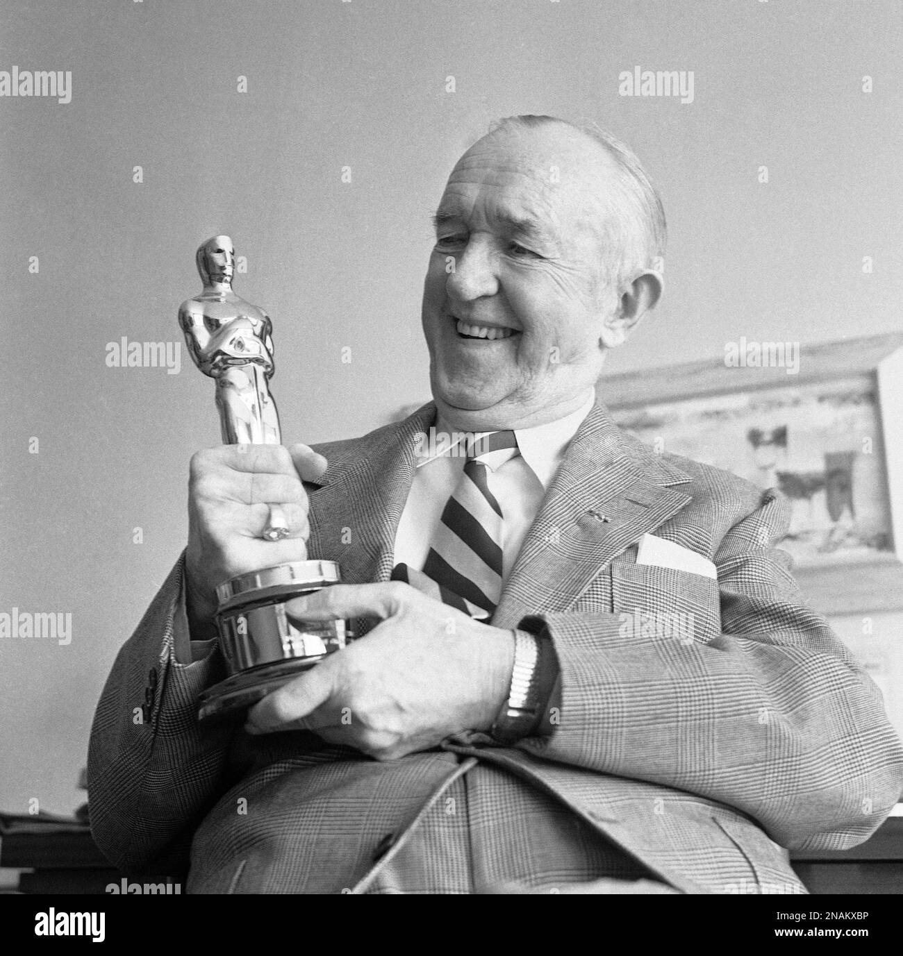 Stan Laurel holds Academy Awards Oscar presented to him for his ...