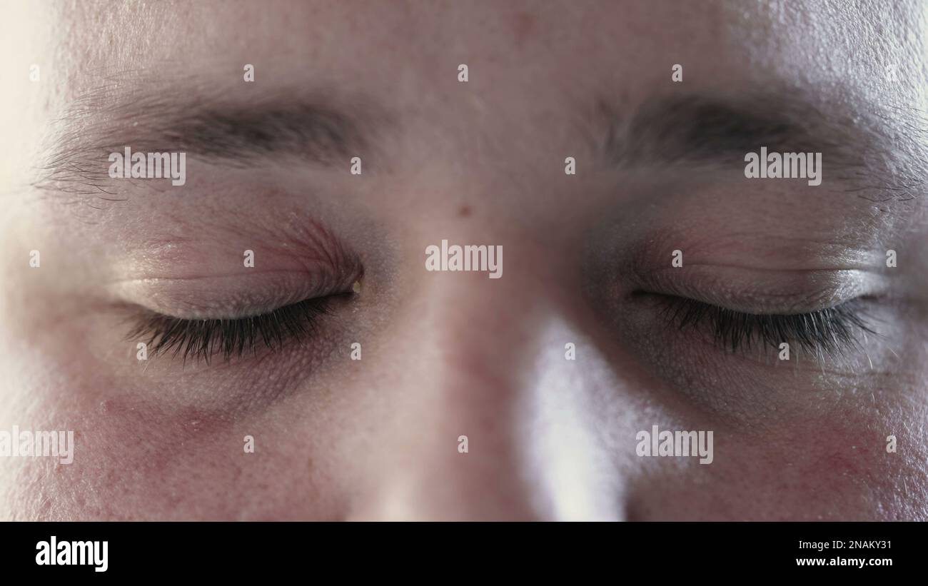Person closing eyes in meditation hi-res stock photography and images ...