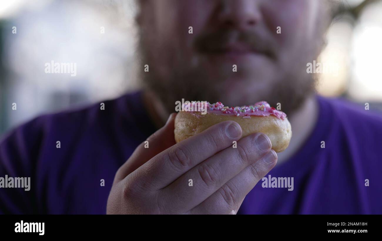 An overweight man eats fast food hi-res stock photography and images ...