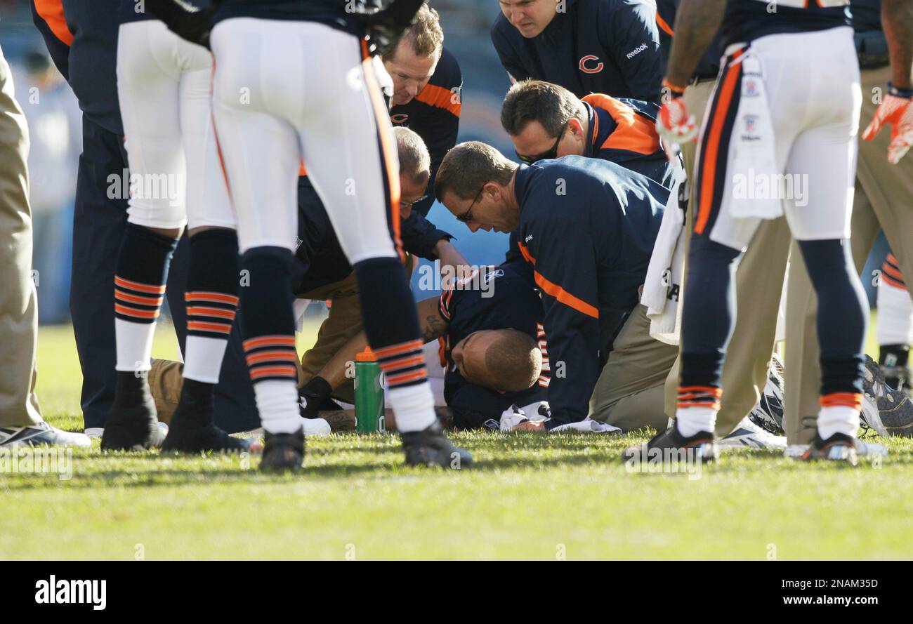 Trainers tend to injured wide receiver Johnny Knox (13) in the first ...