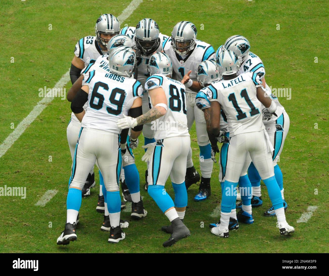 Carolina Panthers huddle in the first quarter of an NFL football game ...