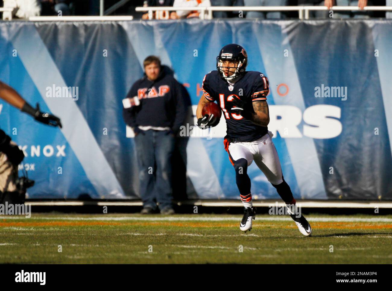 Chicago Bears' Johnny Knox (13) returns the opening kickoff closes in ...