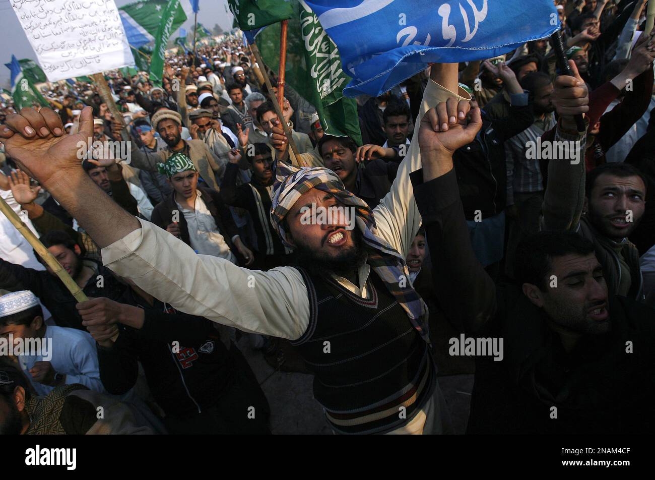 A supporter of a Pakistani religious party Jamaat-e-Islami shouts ...