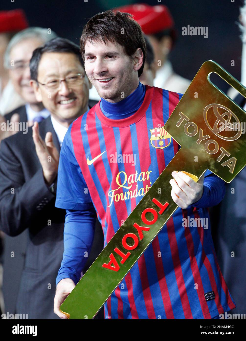 Spain's FC Barcelona midfielder Lionel Messi smiles with a key replica ...