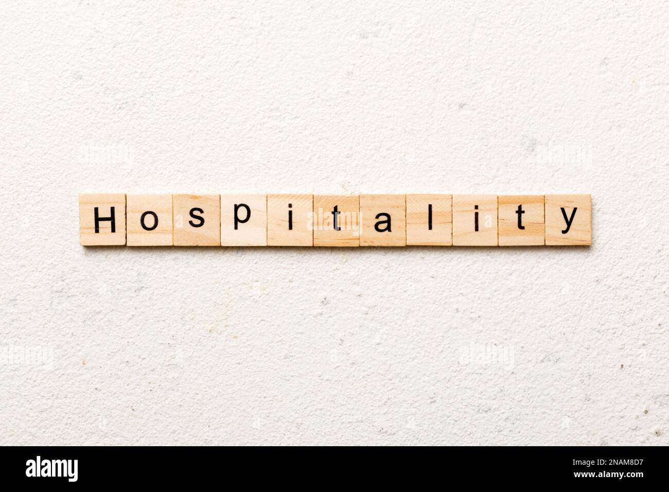 hospitality word written on wood block. hospitality text on table ...