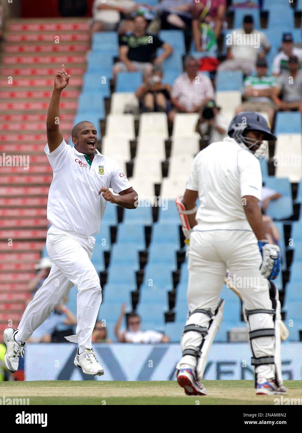 South Africa's bowler Vernon Philander, left, celebrates the wicket of ...