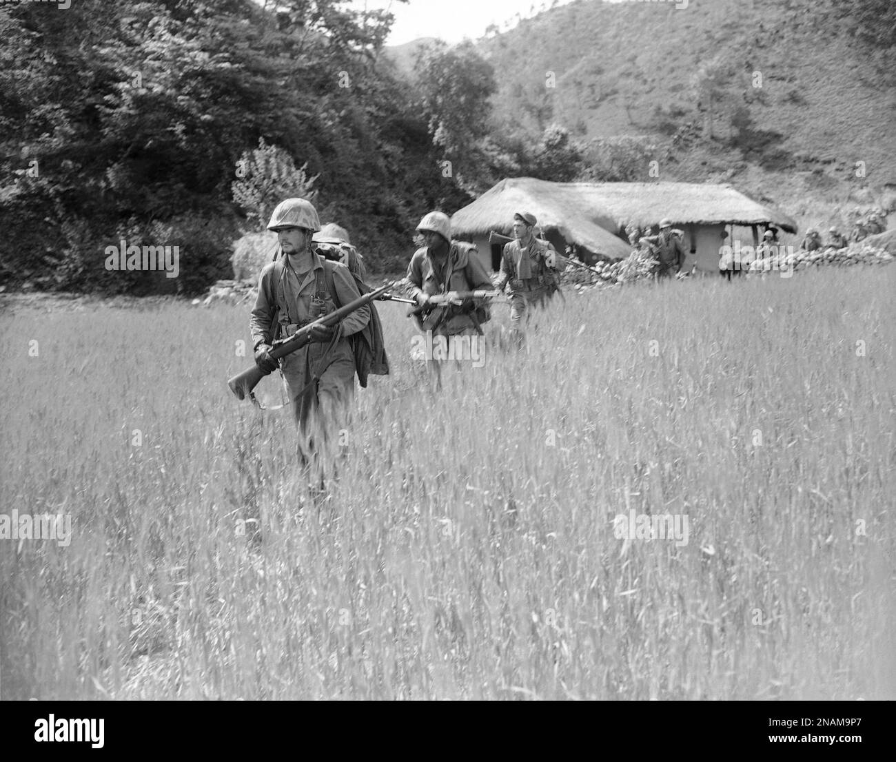 U.S. First Marine Division troops march northward on Korea’s central ...