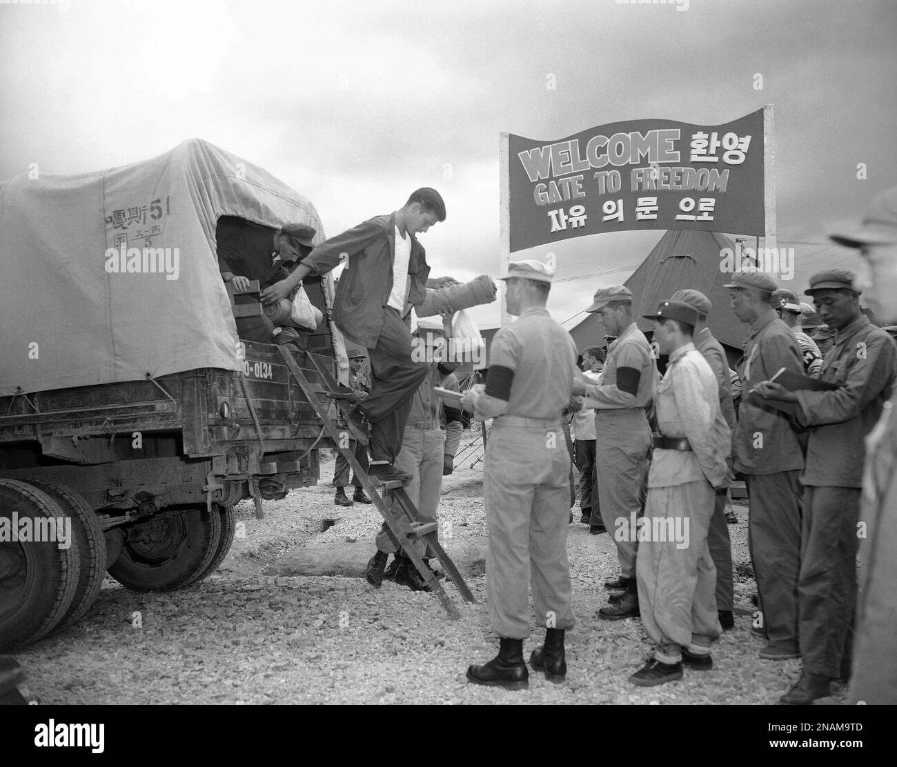 Pfc. Thomas S. Farrell of Trinidad, Colo., leaves a Communist truck at ...