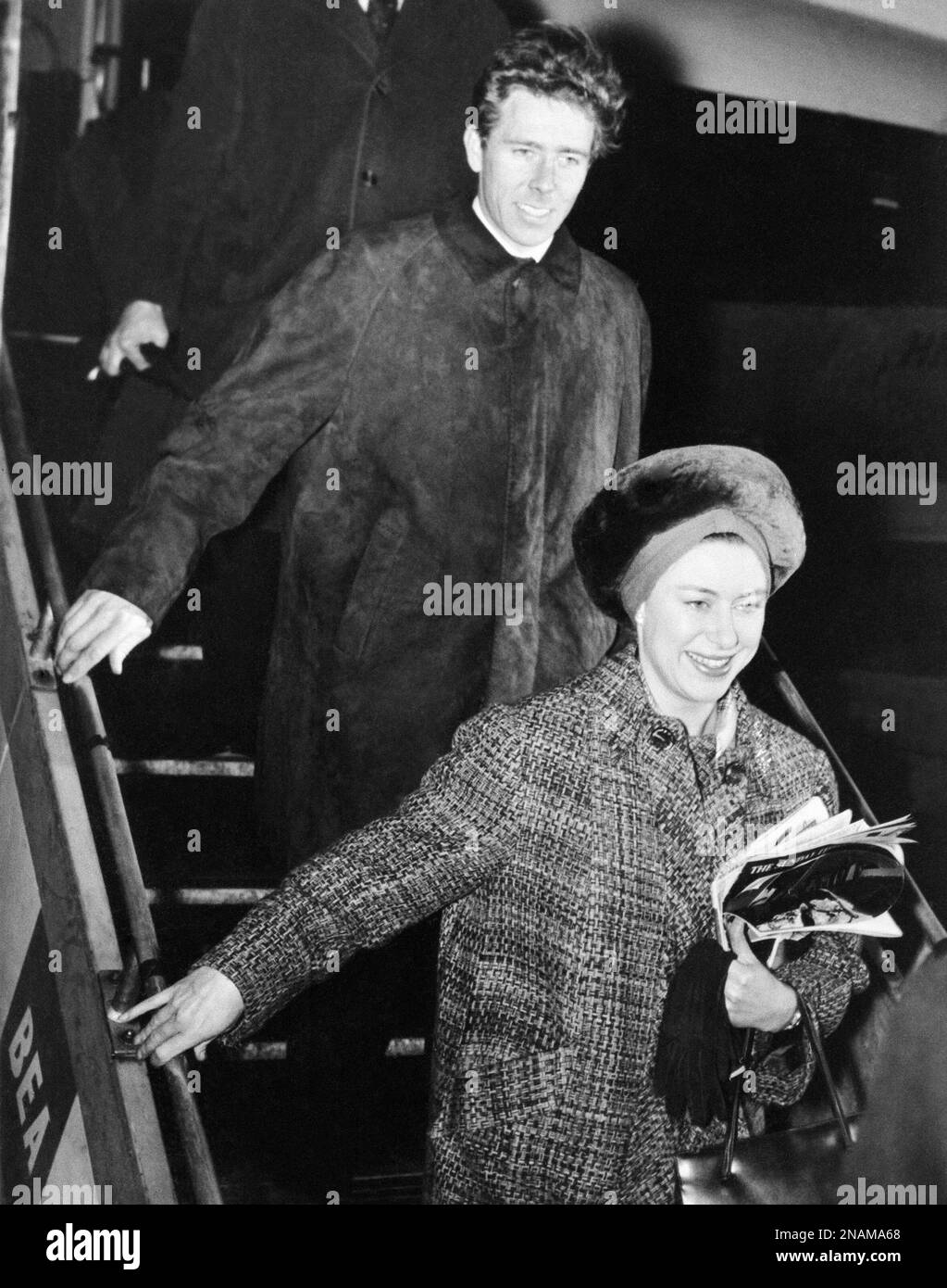 Princess Margaret of England is followed by her husband, Lord Snowdon ...
