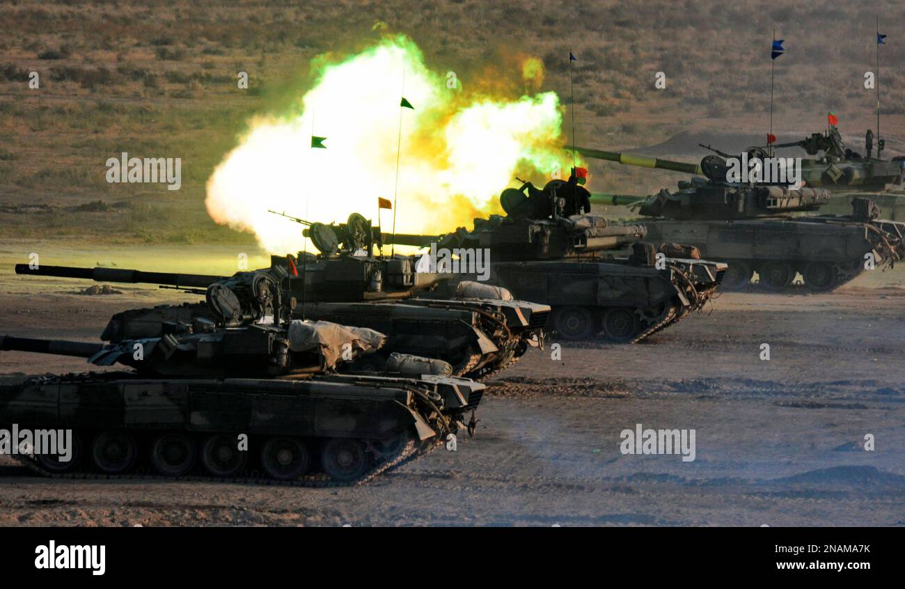 Armoured vehicles fire at a target during a Pakistani army training ...