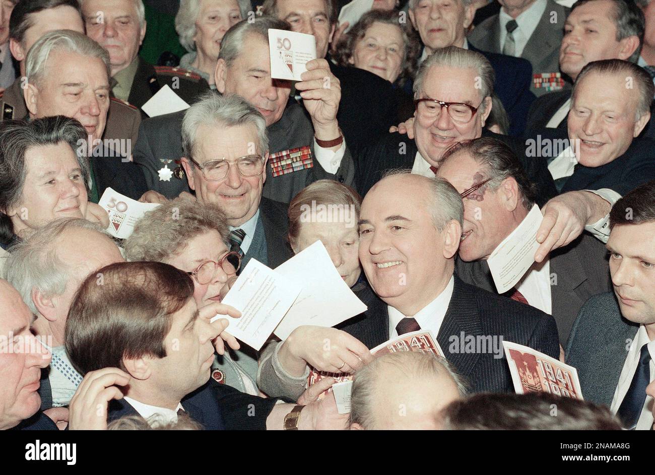 Soviet President Mikhail Gorbachev surrounded by war veterans asking ...