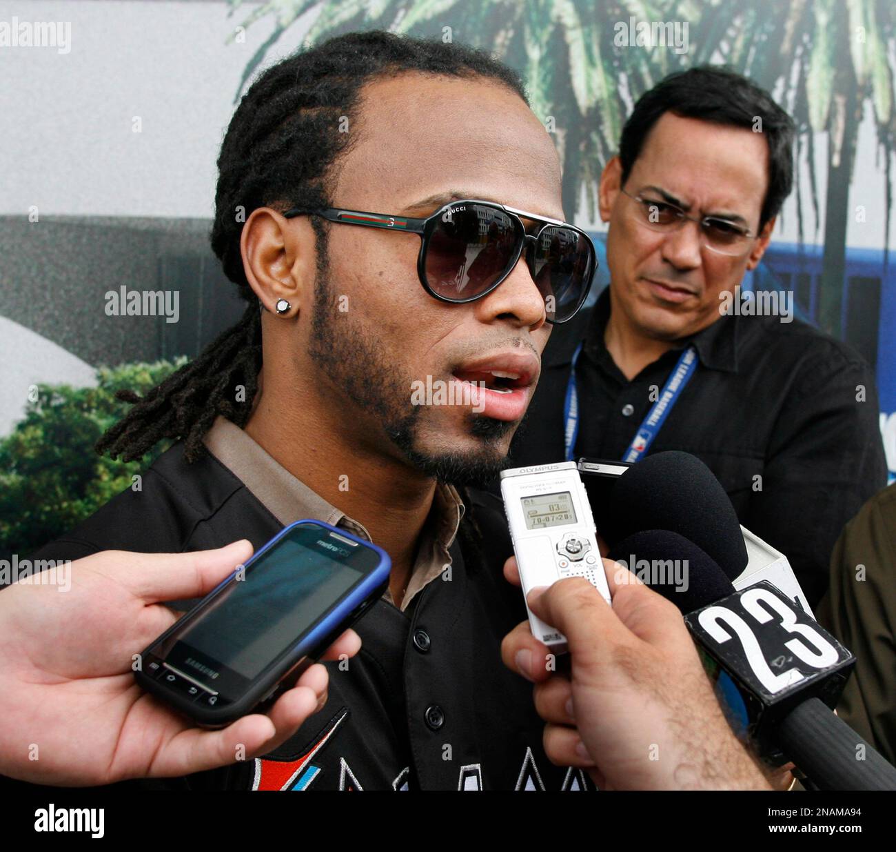 Newly acquired Miami Marlins' Jose Reyes speaks with the media at a ...