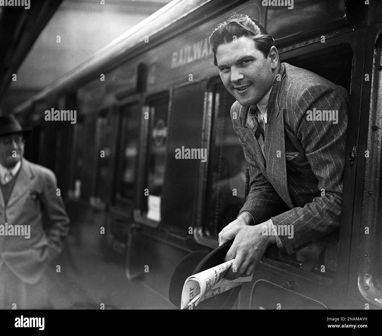 South African boxer Ben Foord, leans out of a train window at Waterloo ...