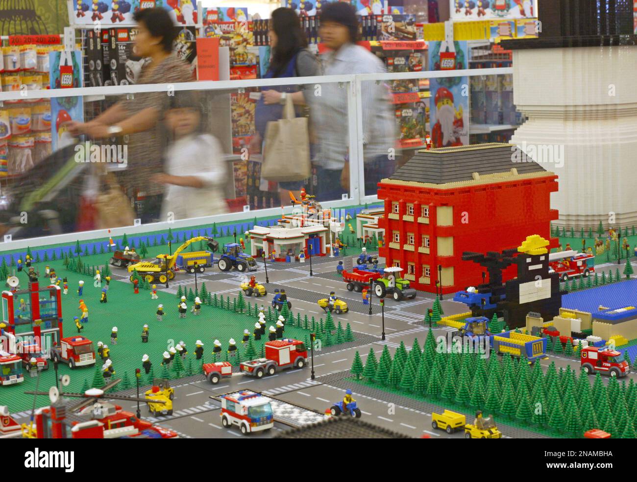 Shoppers walk pass "Lego Christmas City" at Senayan City shopping mall ...