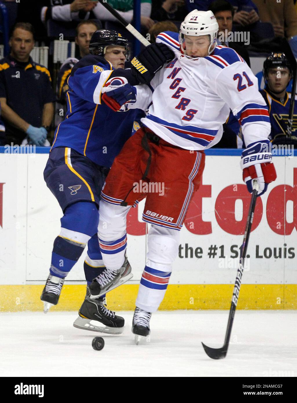 St. Louis Blues' Kris Russell, left, and New York Rangers' Derek Stepan ...