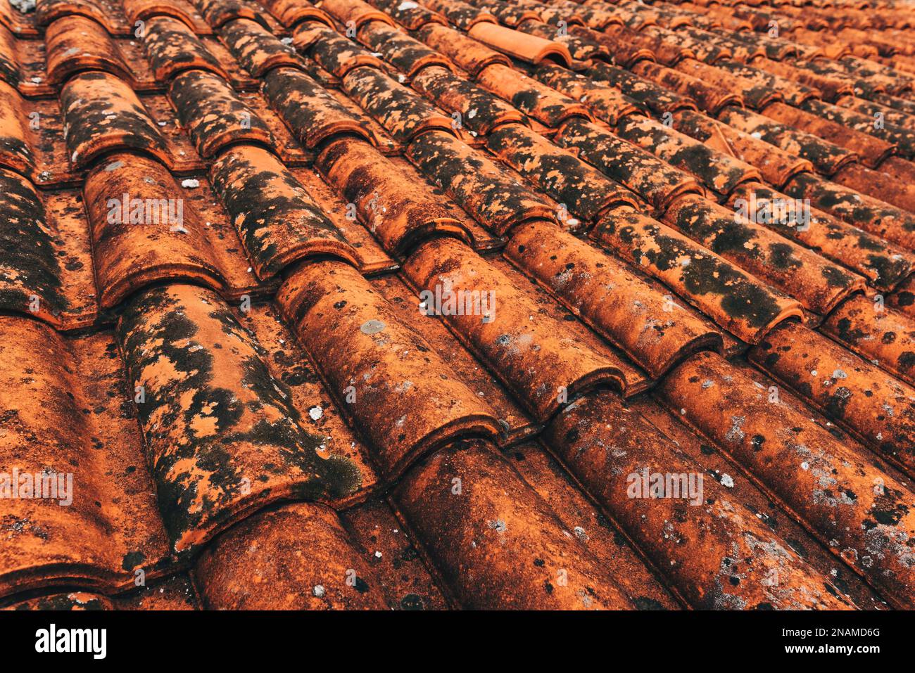 Old rustic terracotta roof tiles pattern as background, architectural ...