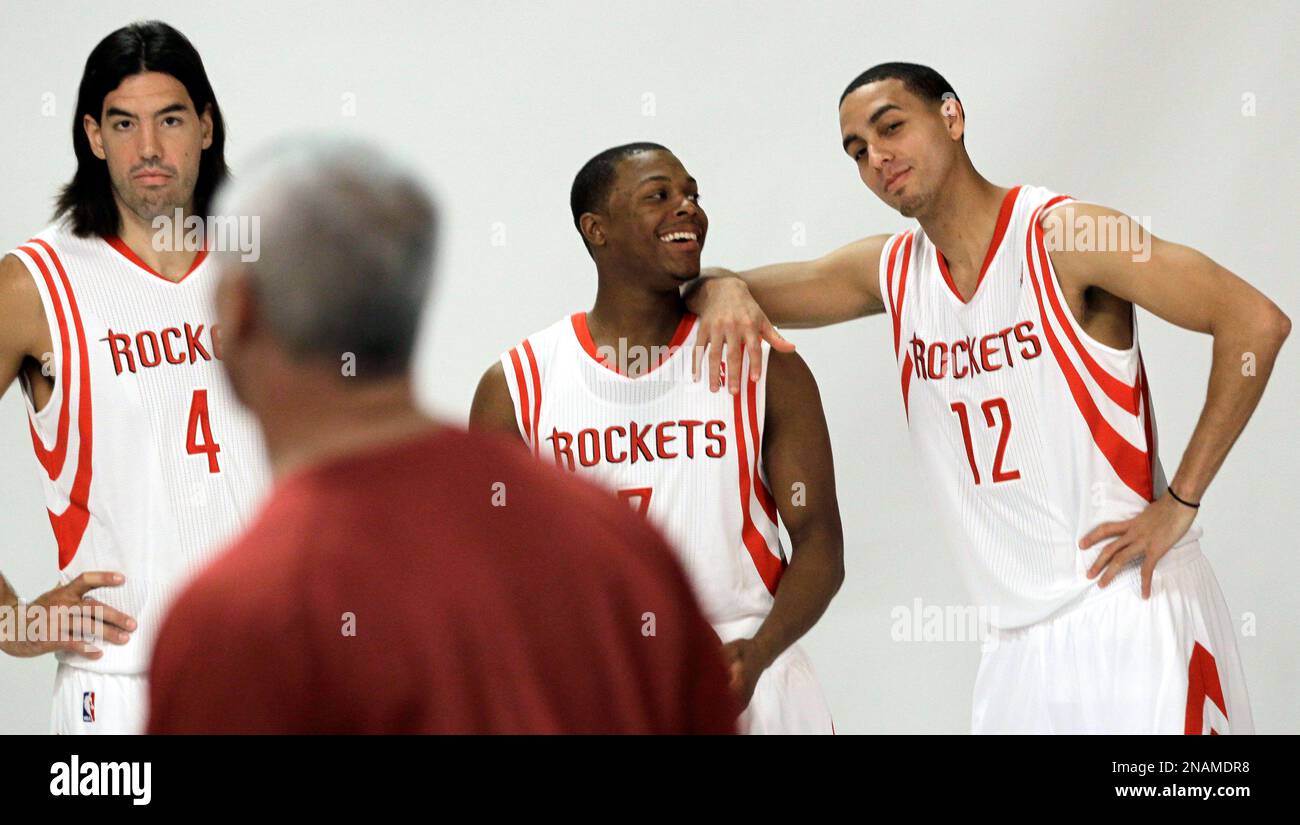 Houston Rockets' Kevin Martin (12) leans on Kyle Lowry (7) as Luis ...