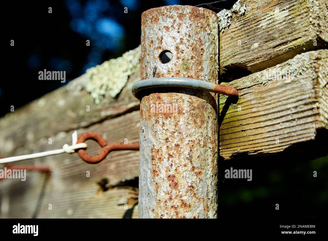 Old Metal Post with Broken Plank and Rusted Eye Bolt Stock Photo - Alamy