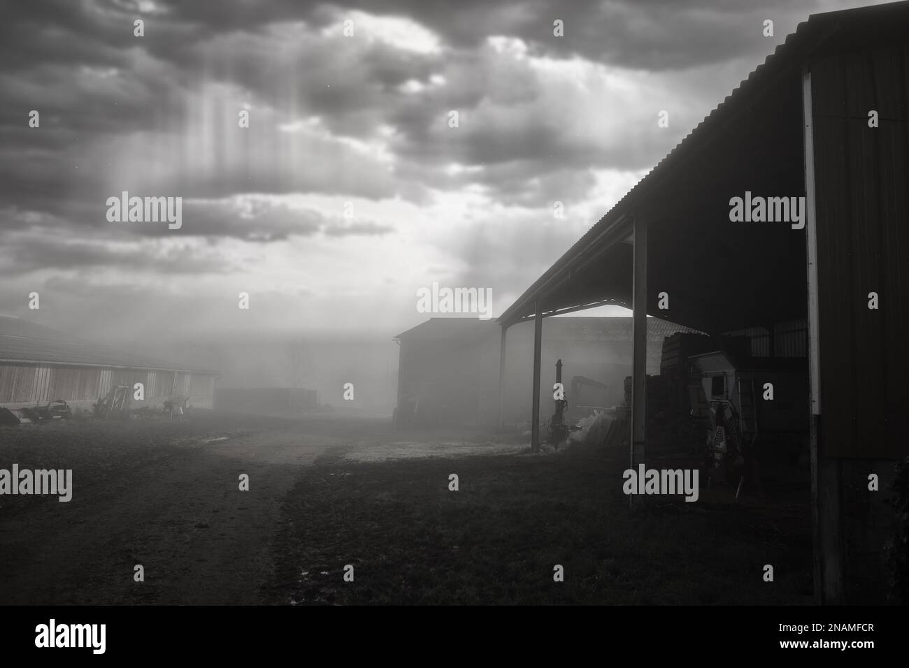 A depressing scenery of a small countryside road with buildings under ...