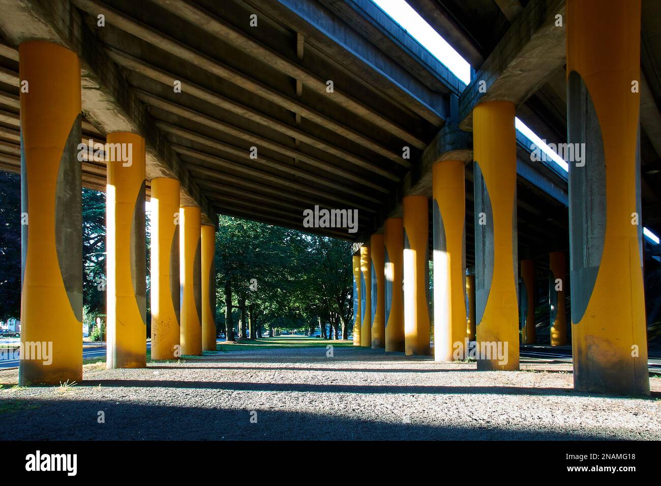 Highway Underpass with Yellow Pillars and Bright Sunlight Stock Photo ...